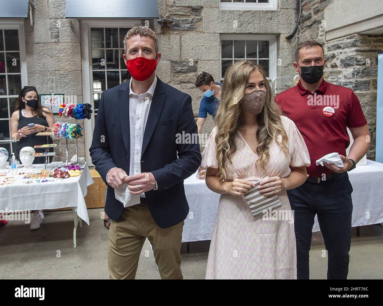Premier Iain Rankin, his wife Mary Chisholm, and Colin Coady, left to right, Liberal candidate ...