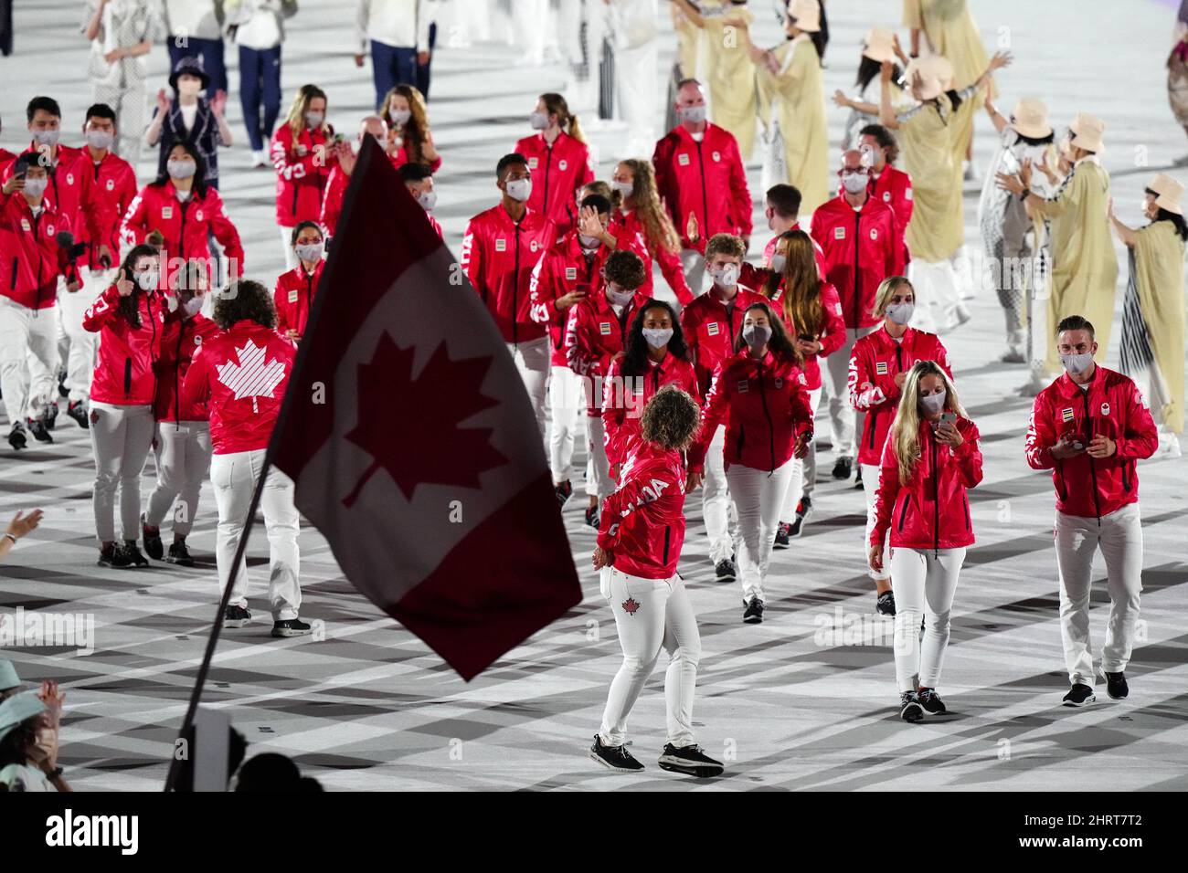 Canadian athletes march into the stadium during the opening ceremonies ...