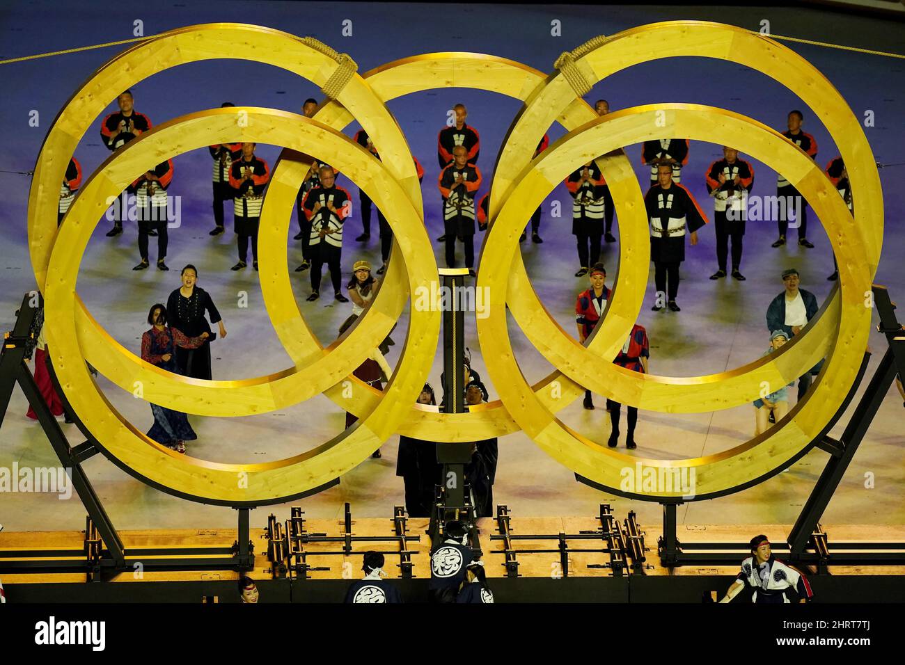 The Olympic rings are shown being built during a performance at the ...