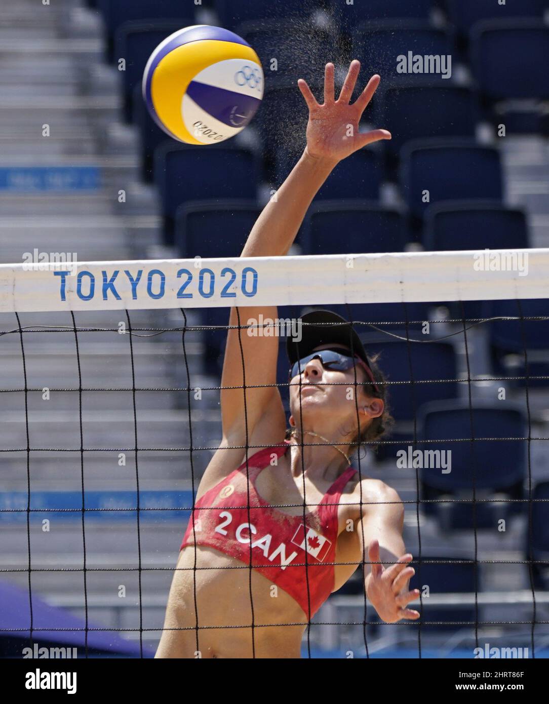 Canada's Melissa Humana-Paredes spikes a ball during beach volleyball ...