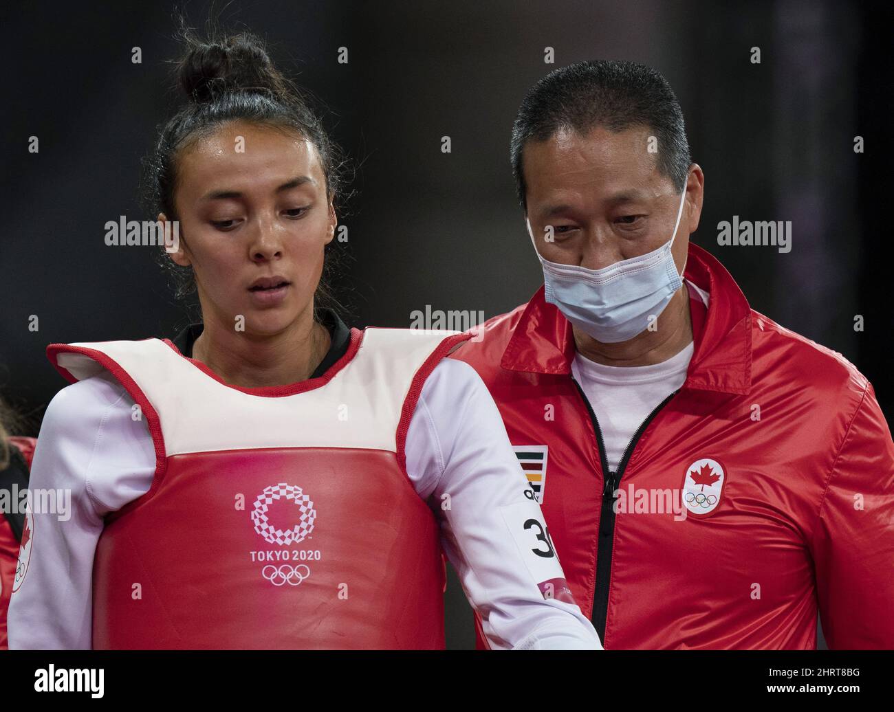 Skylar Park, from Winnipeg, Man., walks with her coach and father Jae ...