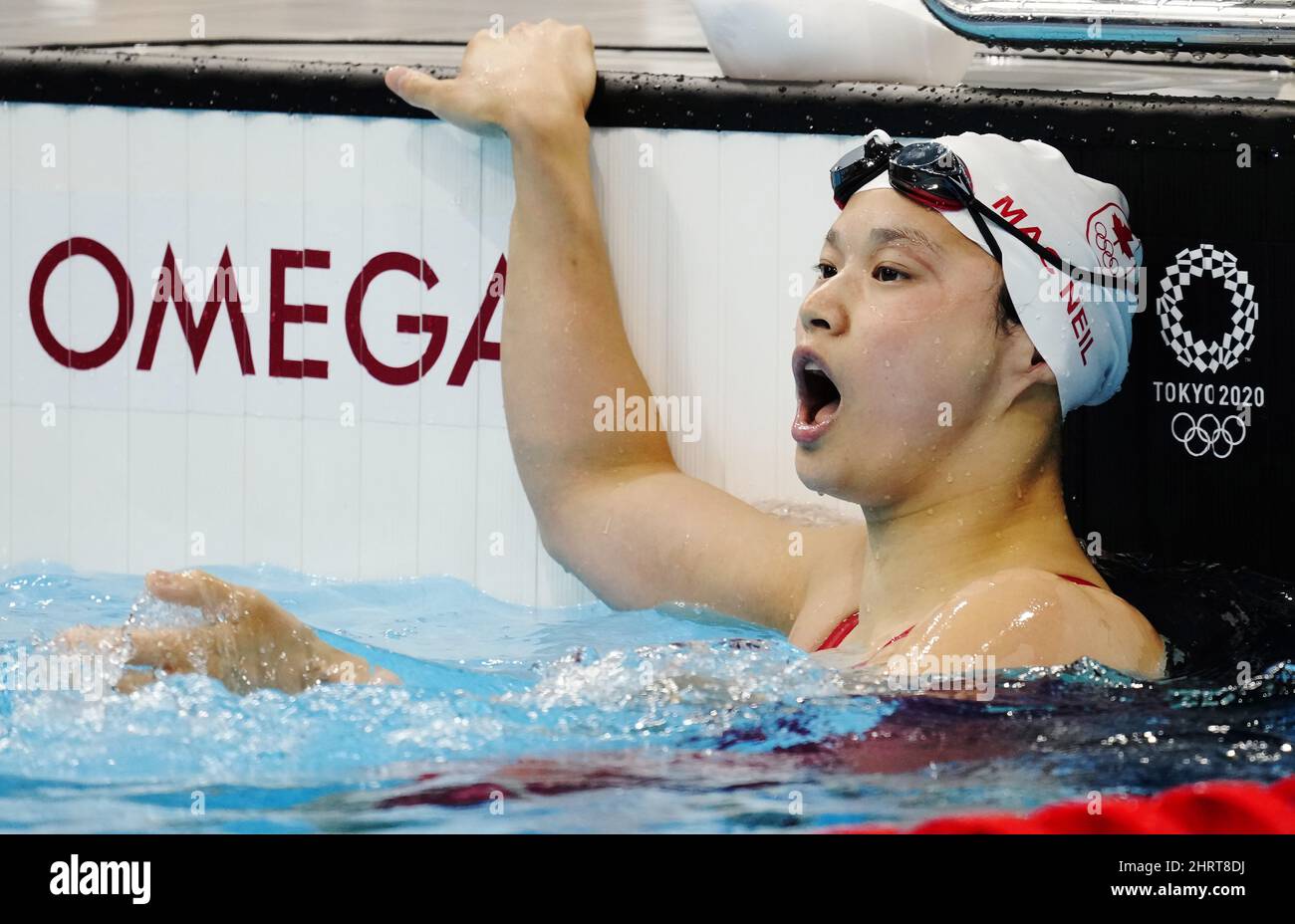Canada's Margaret Mac Neil reacts to her time in a gold medal swim in ...