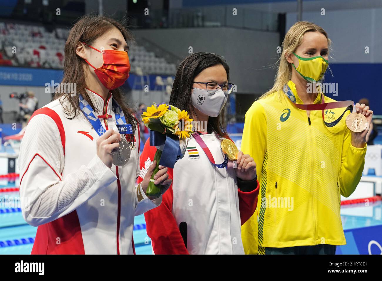 Margaret Mac Neil of Canada, centre, celebrates her gold medal in the ...