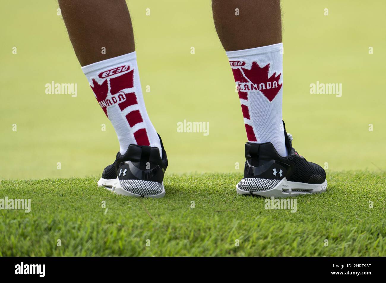 Danny Sahl, caddy for Canada's Corey Conners, shows off his patriotic ...
