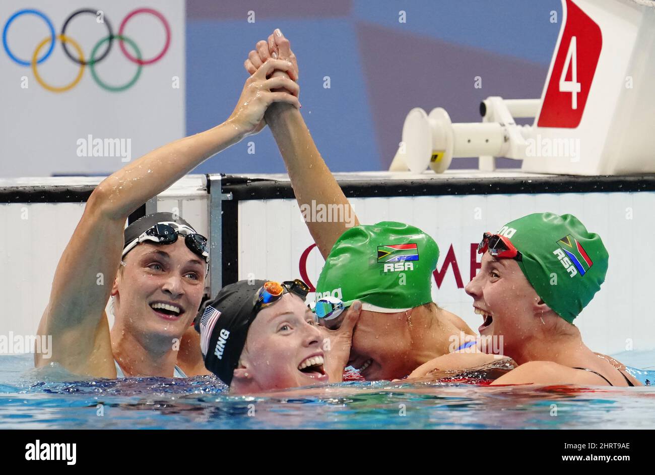 South Africa's Tatjana Schoenmaker, second right, celebrates her gold ...