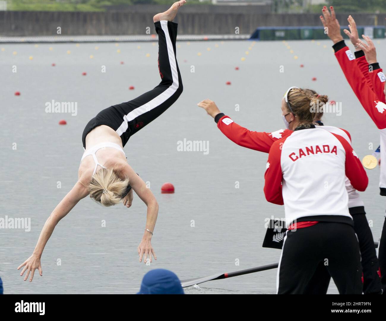 Canadian rowers throw Kristen Kit into the water after winning the gold ...