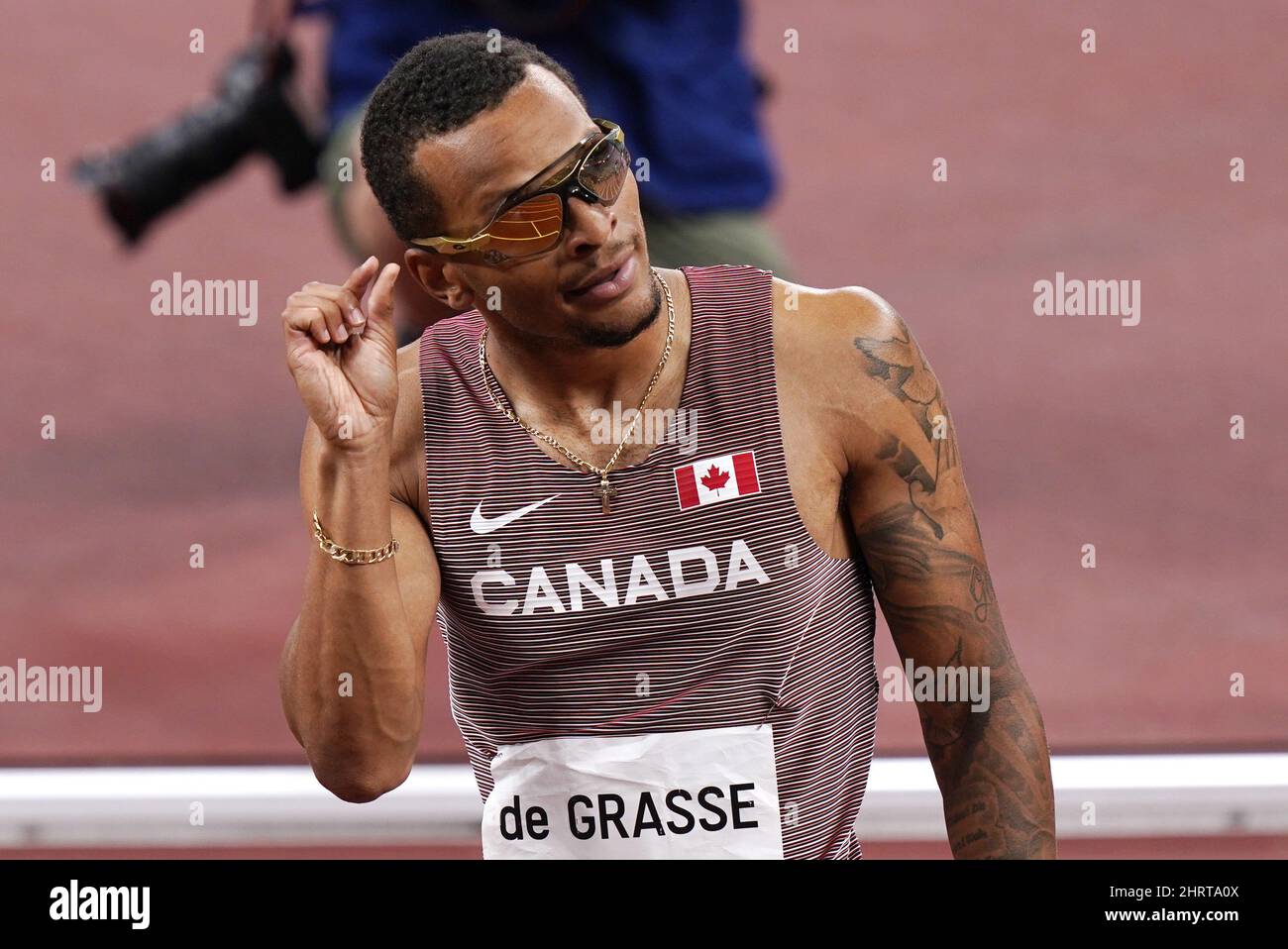 Andre De Grasse of Canada reacts after winning the bronze medal in the ...
