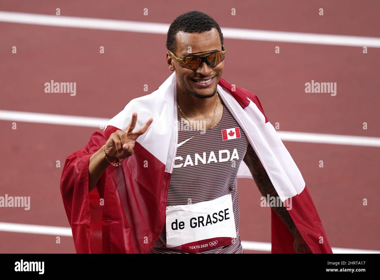 Andre De Grasse of Canada reacts after winning the bronze medal in the ...