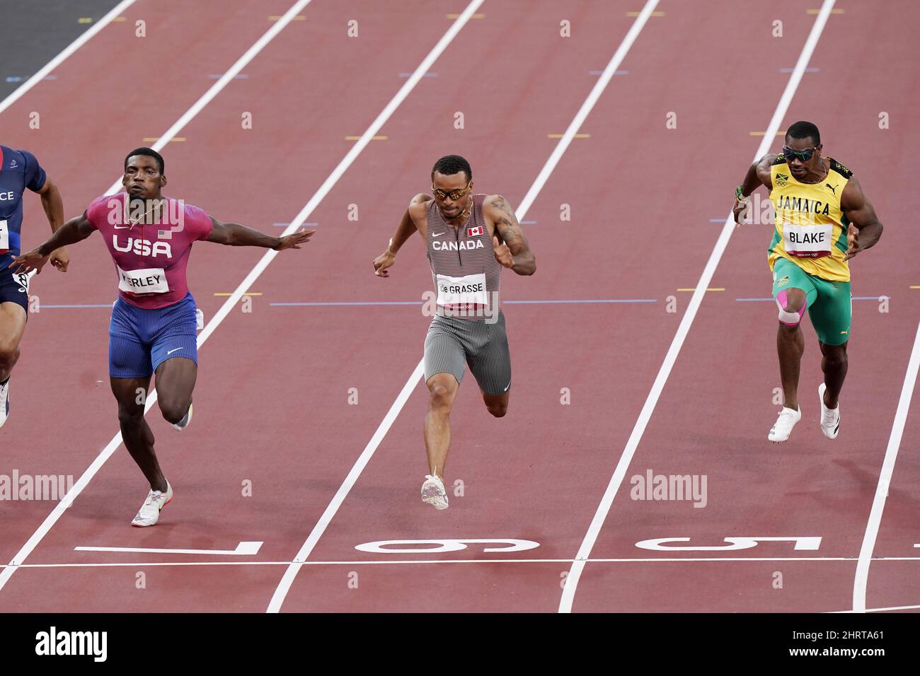 Andre De Grasse of Canada races in the Men's 100m semifinal during the summer Tokyo Olympics in ...
