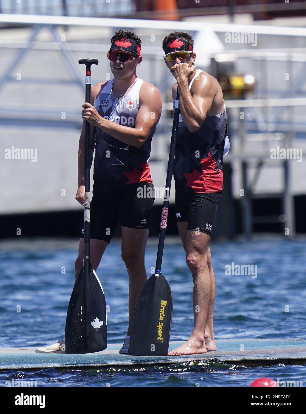 Canada's Roland Varga and Connor Fitzpatrick rest after competing in ...