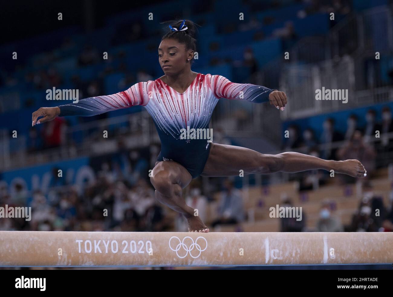 Simone Biles, from the United States, competes in the balance beam ...