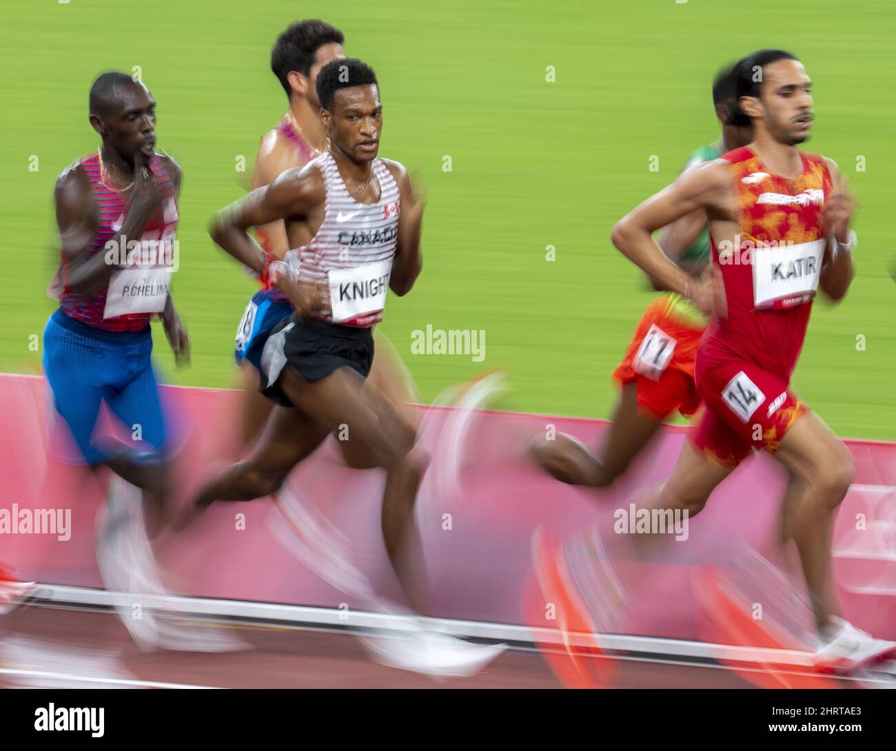 Canadaâ€™s Justyn Knight looks over to check his position on his way to ...