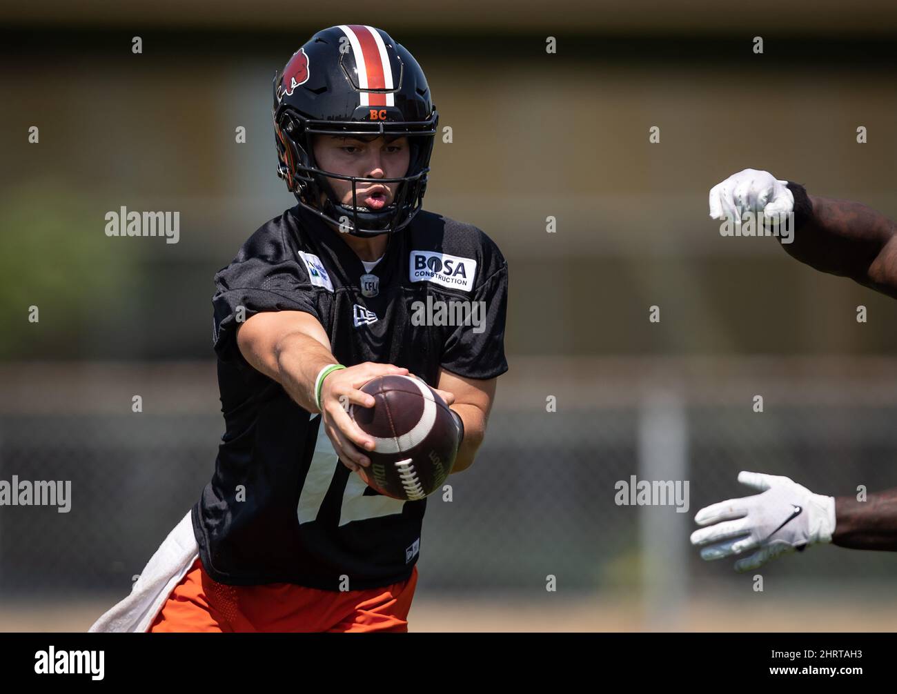 B.C. Lions quarterback Nathan Rourke fakes a handoff during practice at ...
