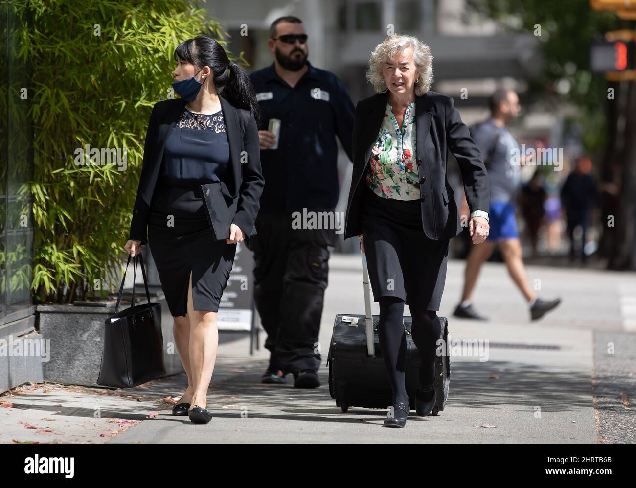 Defence lawyer Mona Duckett, front right, leaves B.C. Supreme Court ...