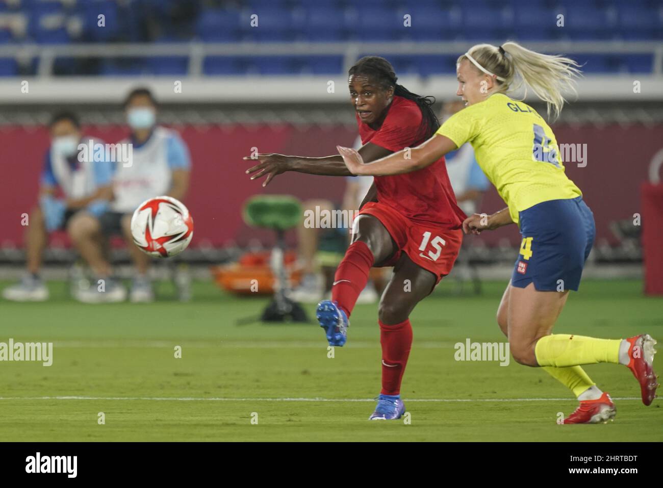 Canada's Nichelle Prince kicks the ball while under pressure from ...