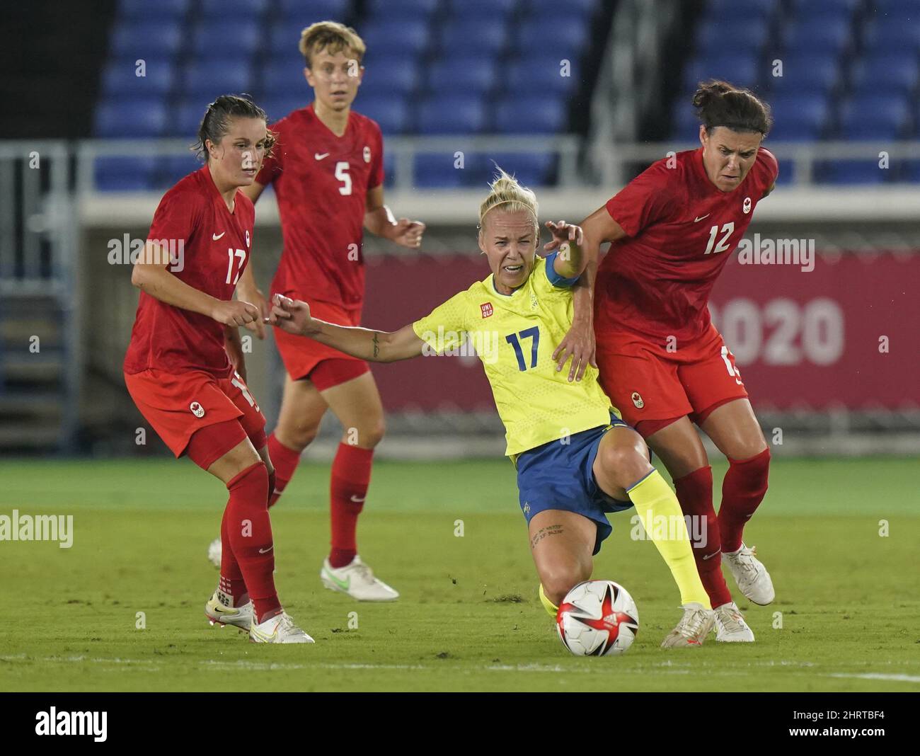 Canada's Christine Sinclair (right) battles Sweden's Caroline Seger for ...