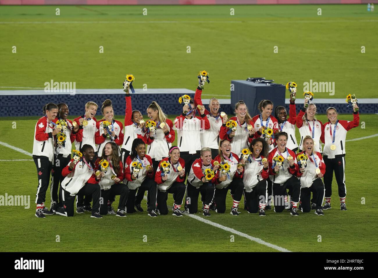 Canadian soccer players pose for a team photo after their win against ...