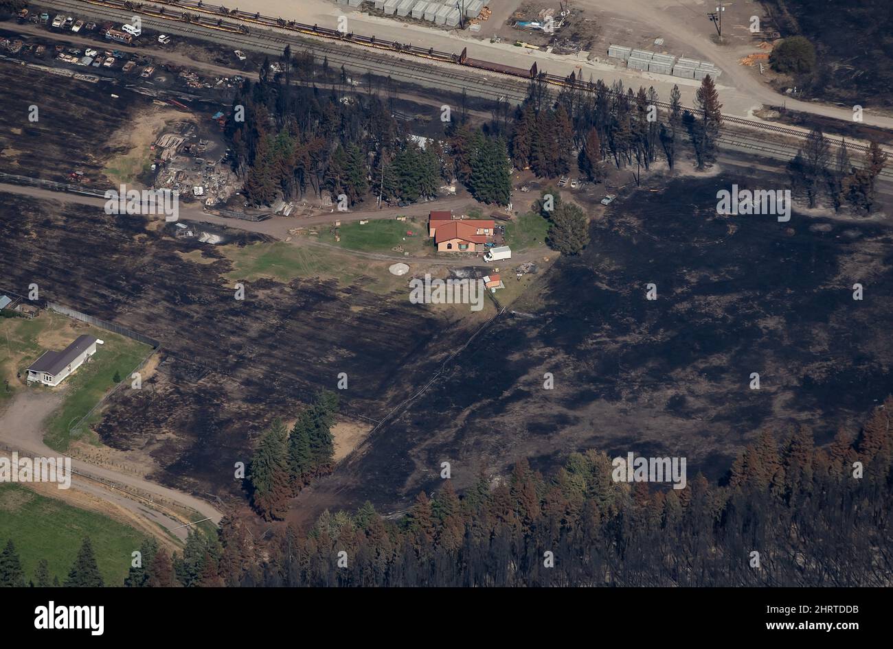 A house remains standing in an area of Monte Lake affected by the White ...