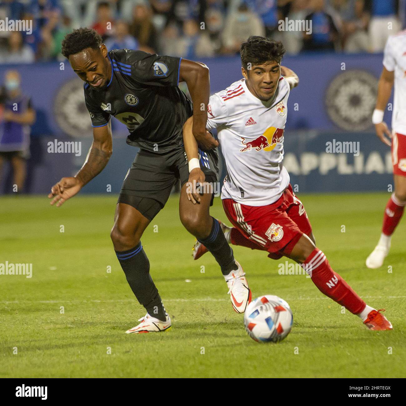 CF Montreal's Mason Toye, left, and New York Red Bulls' Sean Davis ...