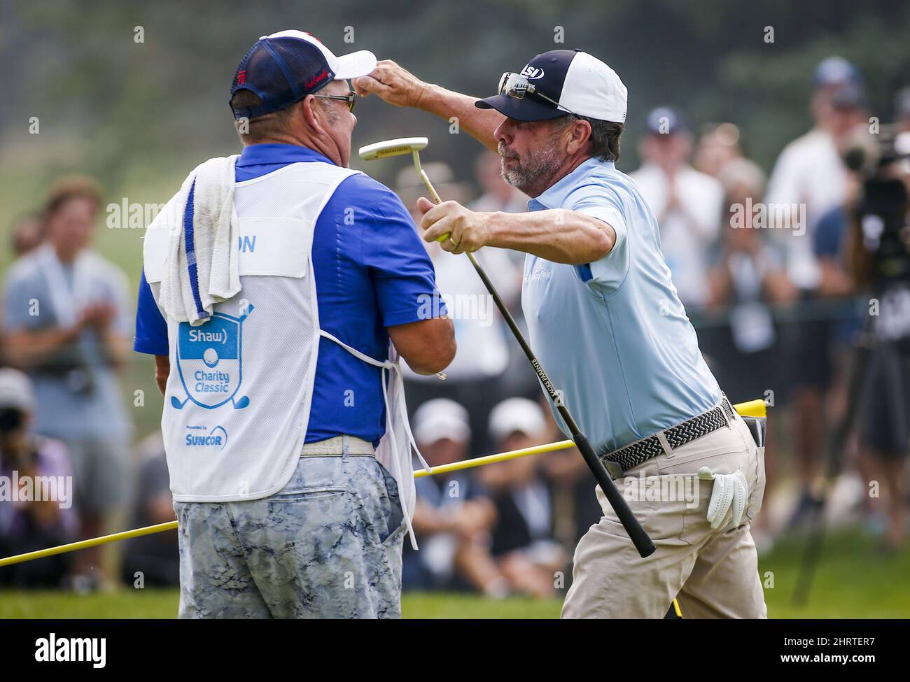 Doug Barron, right, of the United States, celebrates with his caddie ...