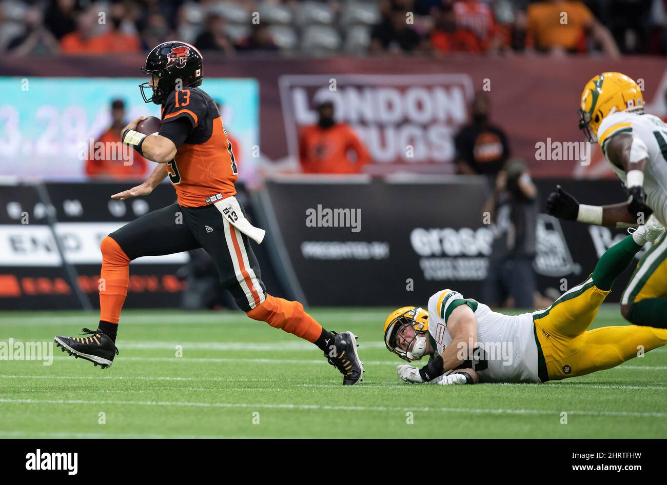 B.C. Lions quarterback Michael Reilly (13) gets away from Edmonton Elks ...