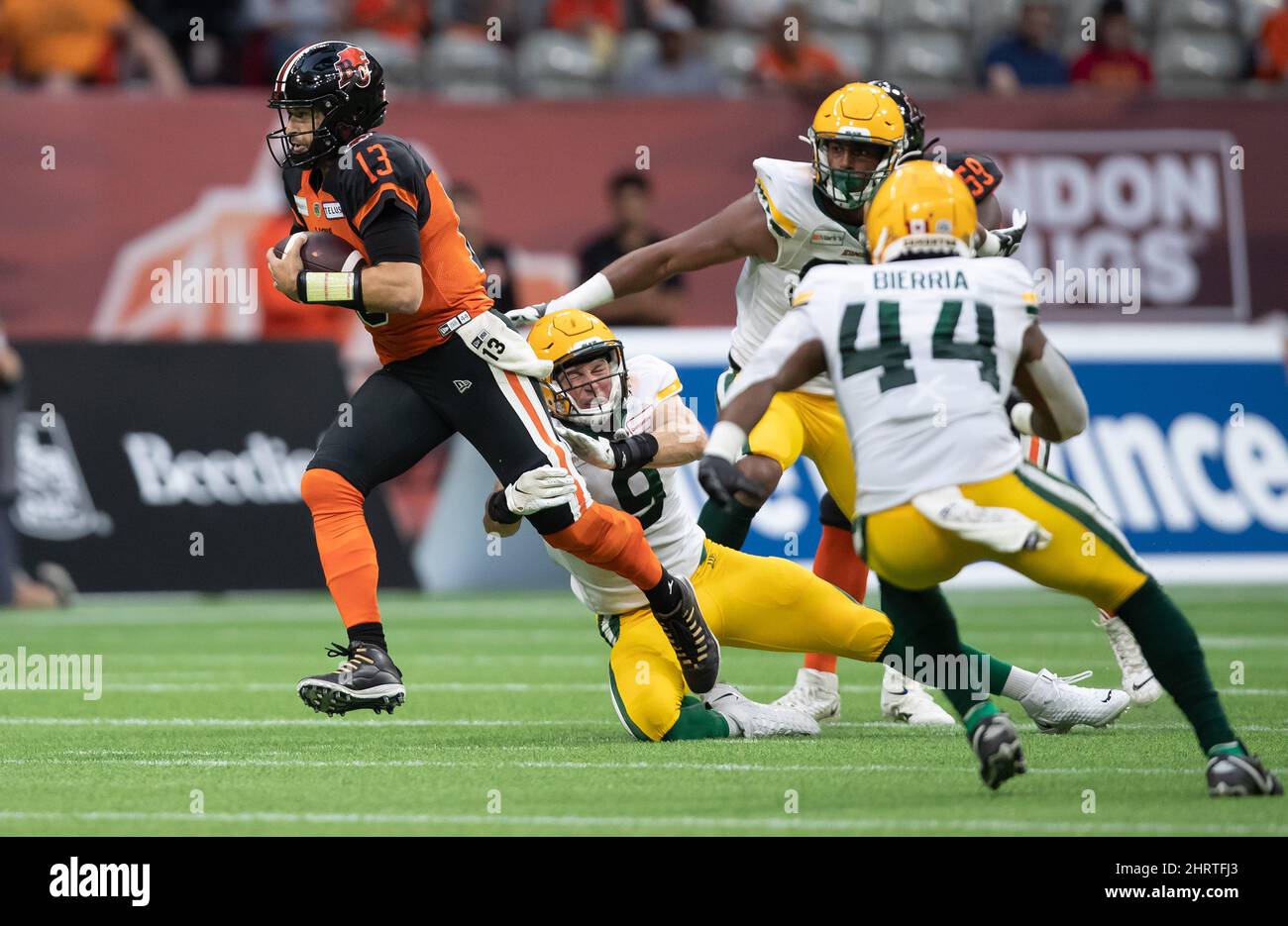 B.C. Lions quarterback Michael Reilly (13) gets away from Edmonton Elks ...