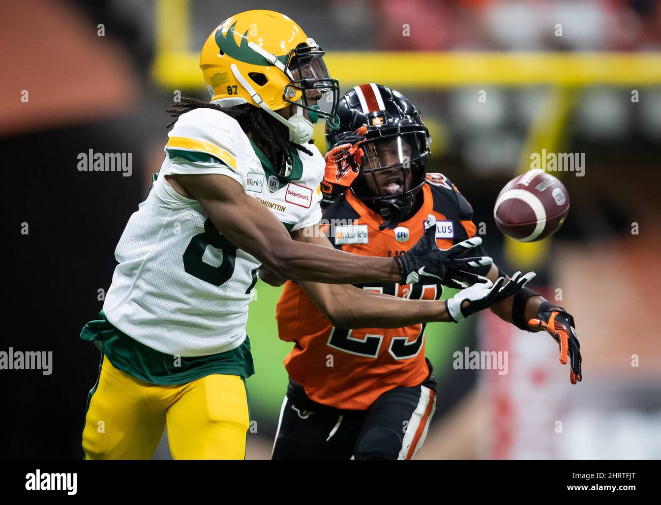 Edmonton Elks' Derel Walker, left, gets his hands on the ball but drops ...