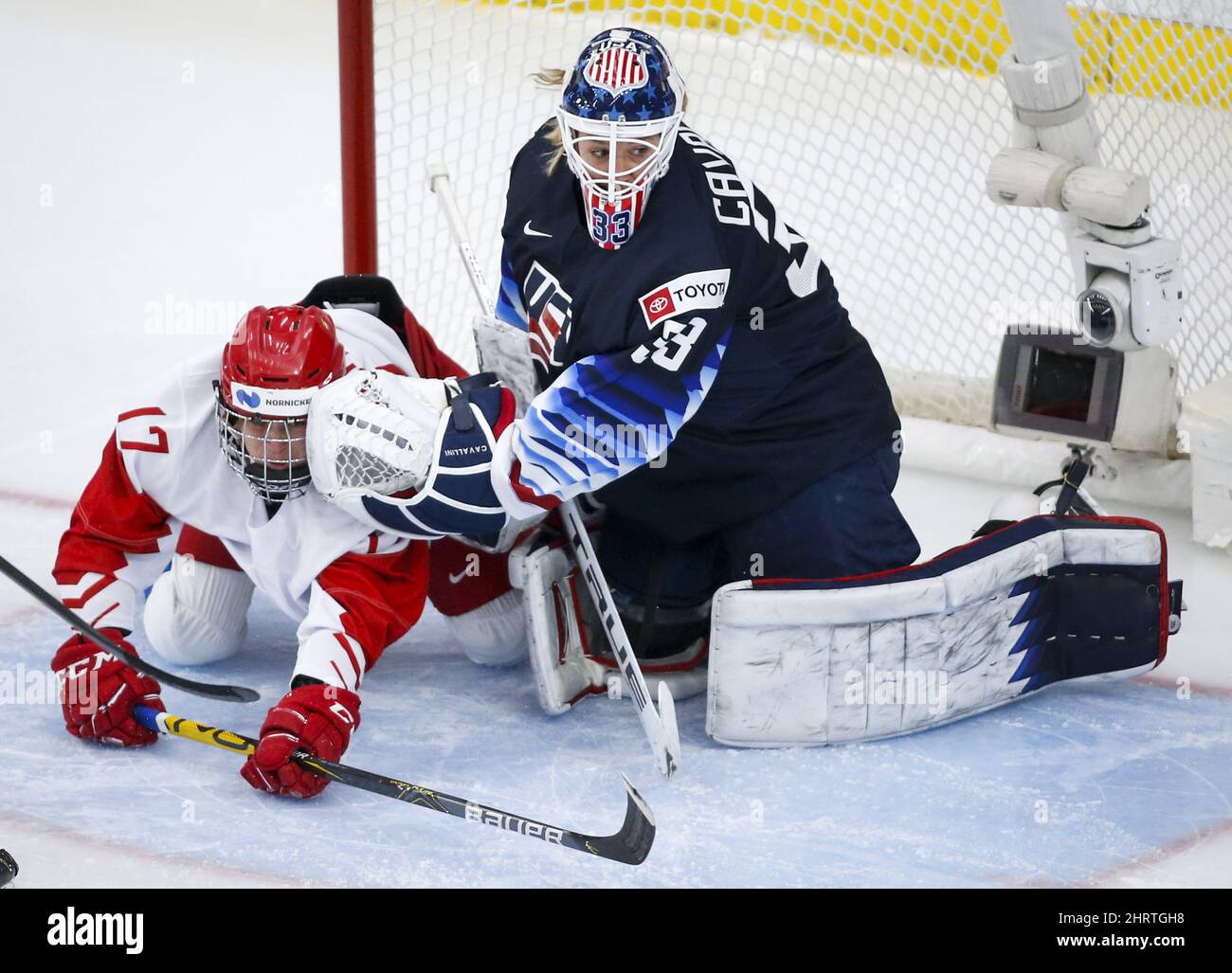 Russia's Fanuza Kadirova, left, crashes into goalie Alex Cavallini, of ...