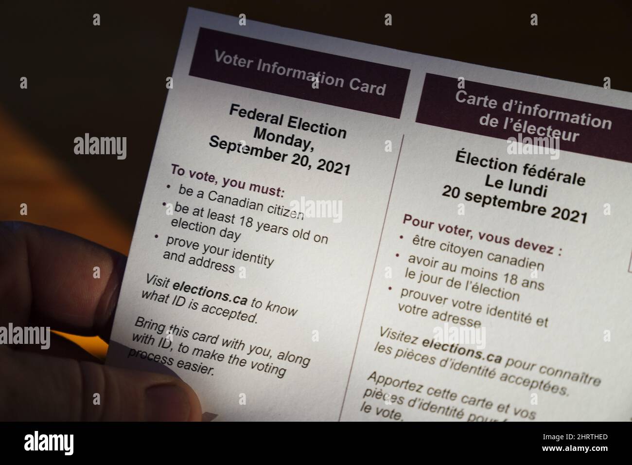 A person holds an Elections Canada voter information card after ...