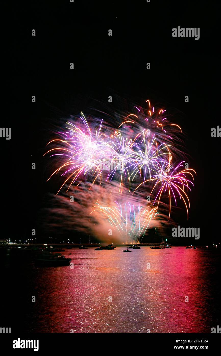 View of huge colorful British firework championships over the harbor in ...