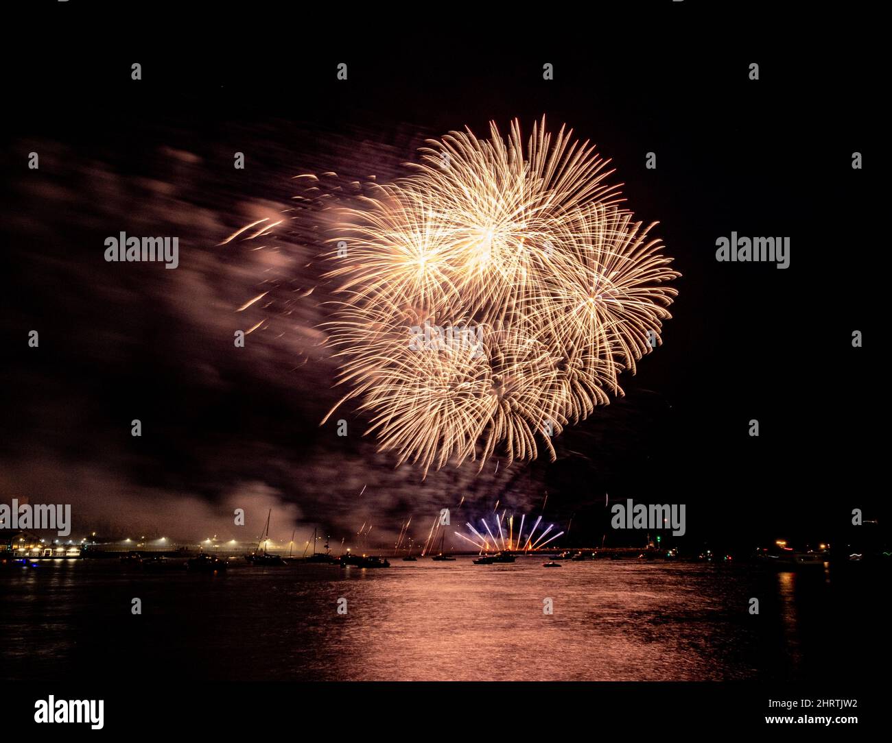 View of huge colorful British firework championships over the harbor in ...