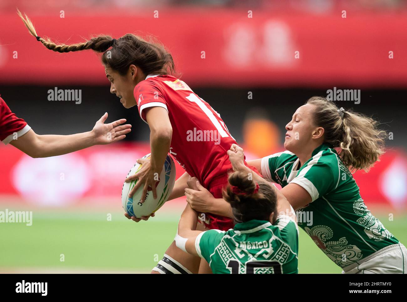 Canada's Kiri Ngawati, left, is tackled by Mexico's Rosa Rivera, right ...