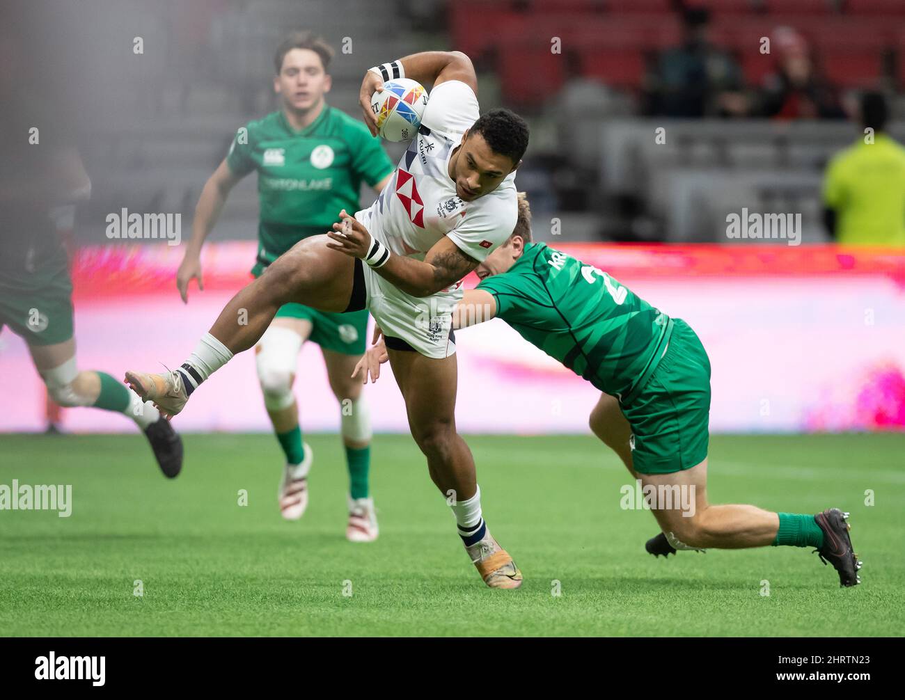 Hong Kong's Max Denmark, left, gets away from Ireland's Liam Turner and ...