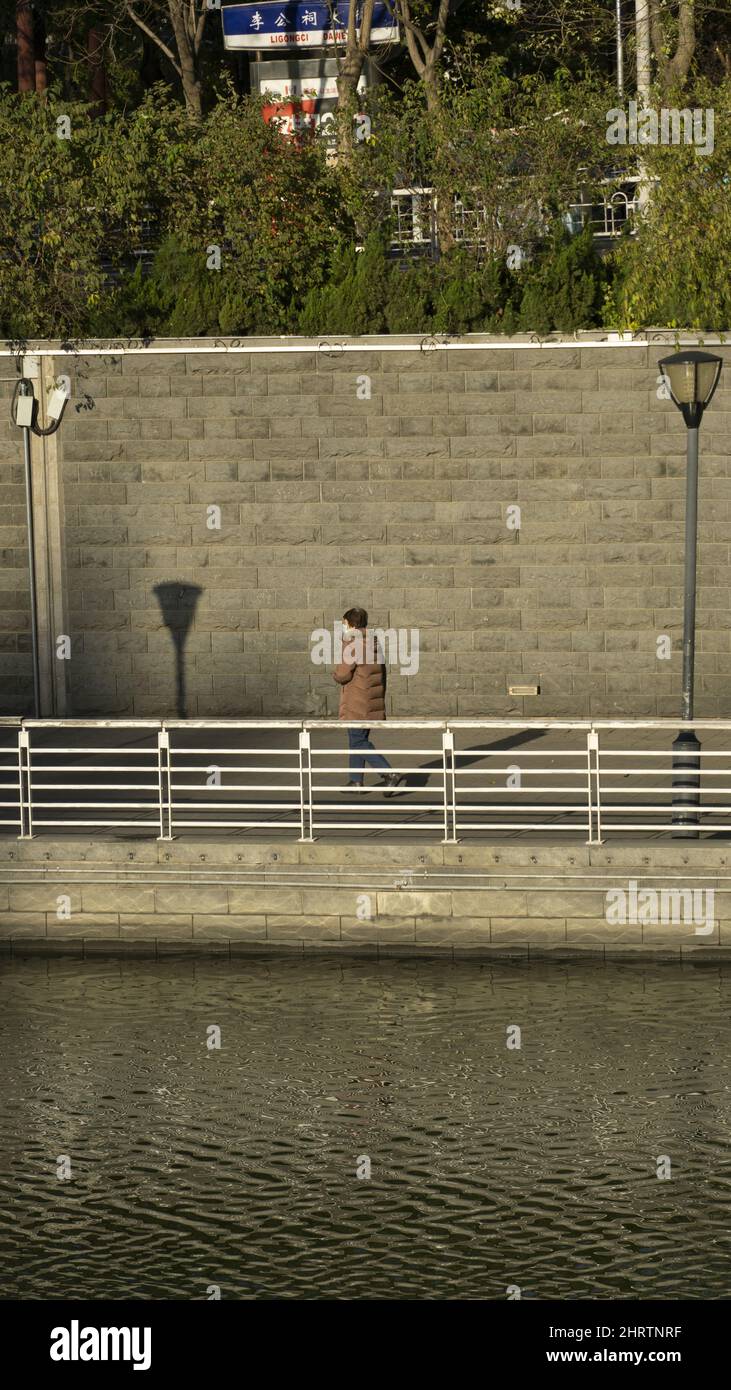 The afternoon riverside with people walking Stock Photo - Alamy