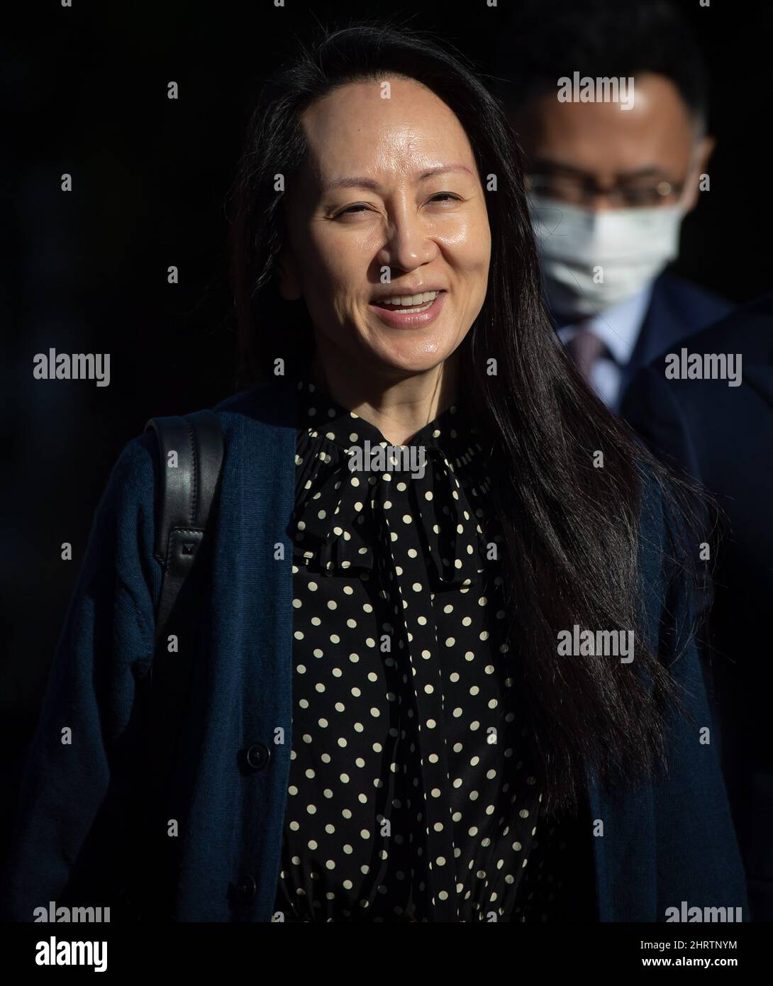 Meng Wanzhou, chief financial officer of Huawei, smiles as she leaves ...