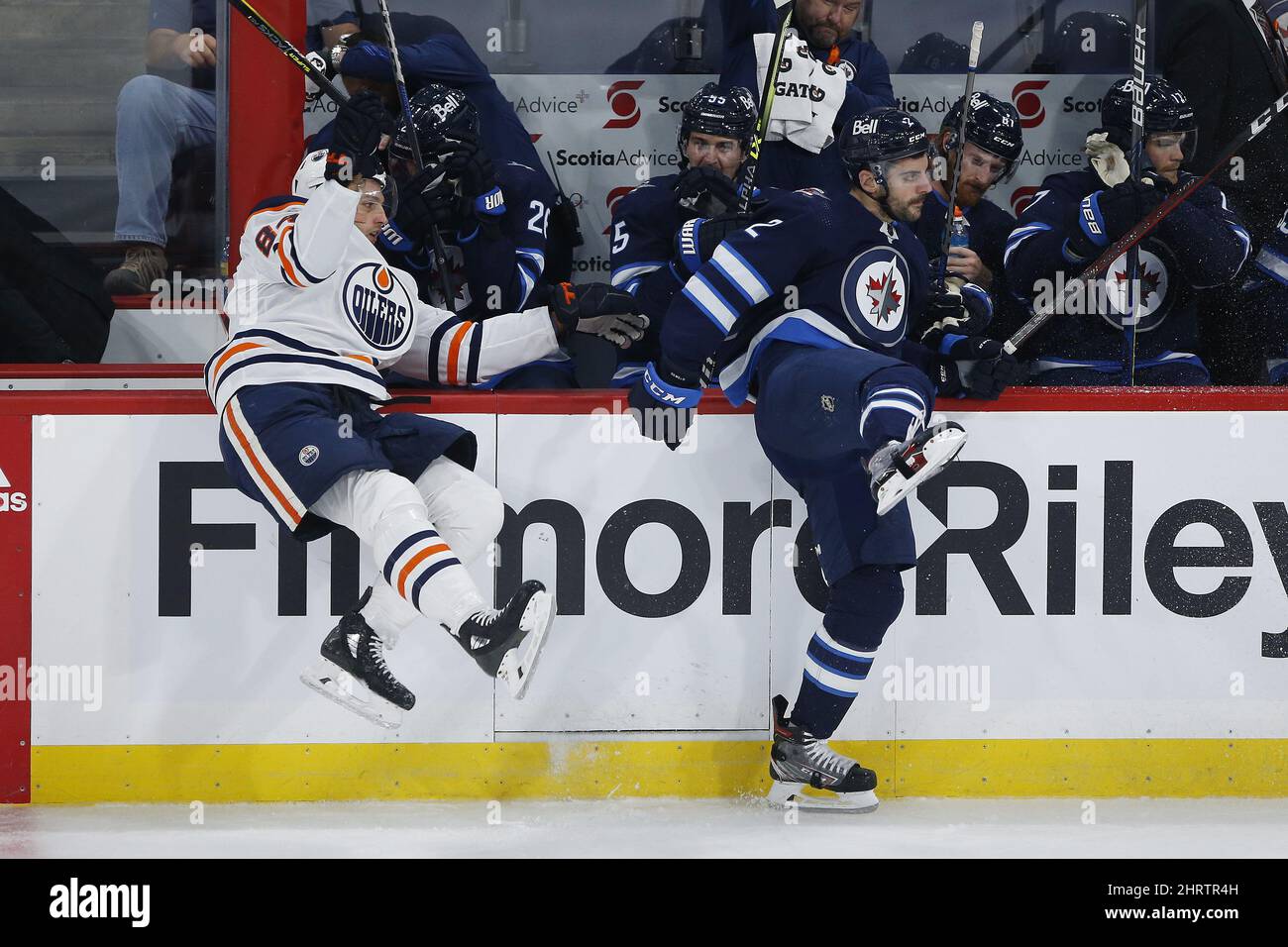 Winnipeg Jets' Dylan DeMelo (2) and Edmonton Oilers' William Lagesson ...