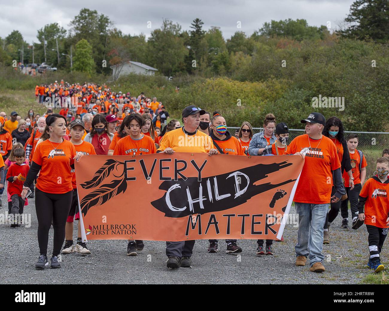 Community members and area residents walk as they honour the National ...