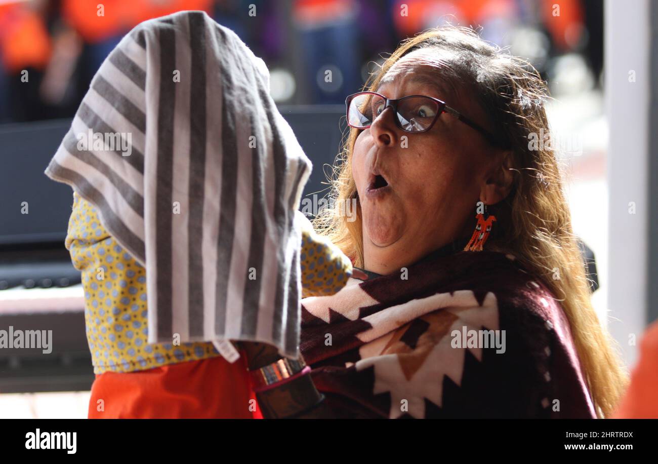 Amy Horne makes faces with a family member as she joins people ...