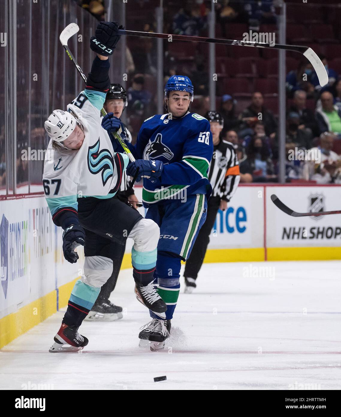 Seattle Kraken's Morgan Geekie, left, and Vancouver Canucks' William ...