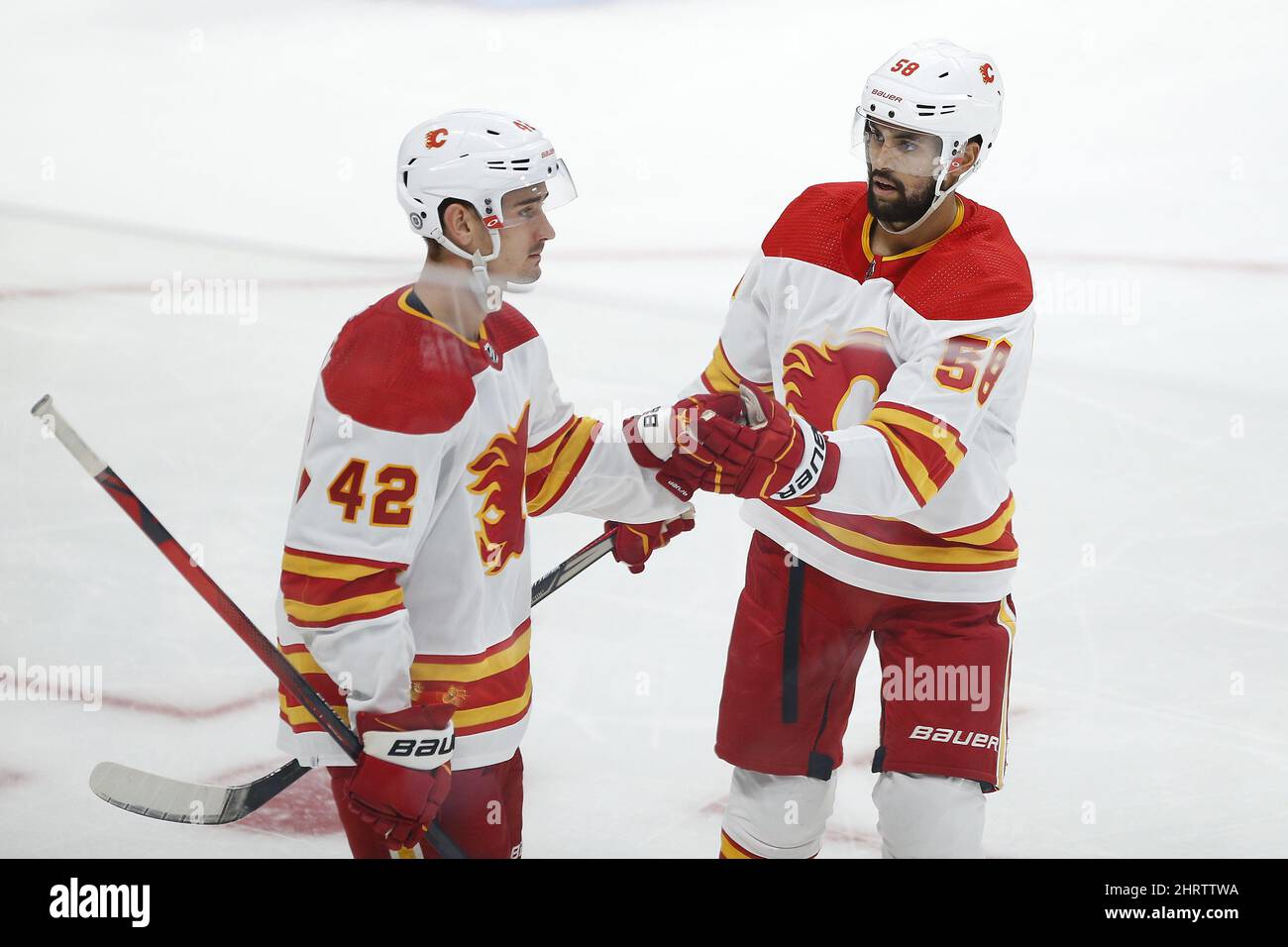Calgary Flames' Glenn Gawdin (42) and Oliver Kylington (58) celebrate ...