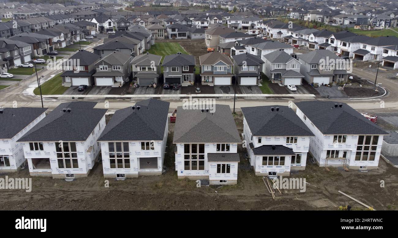 In this photo taken using a drone, homes under construction are seen in ...