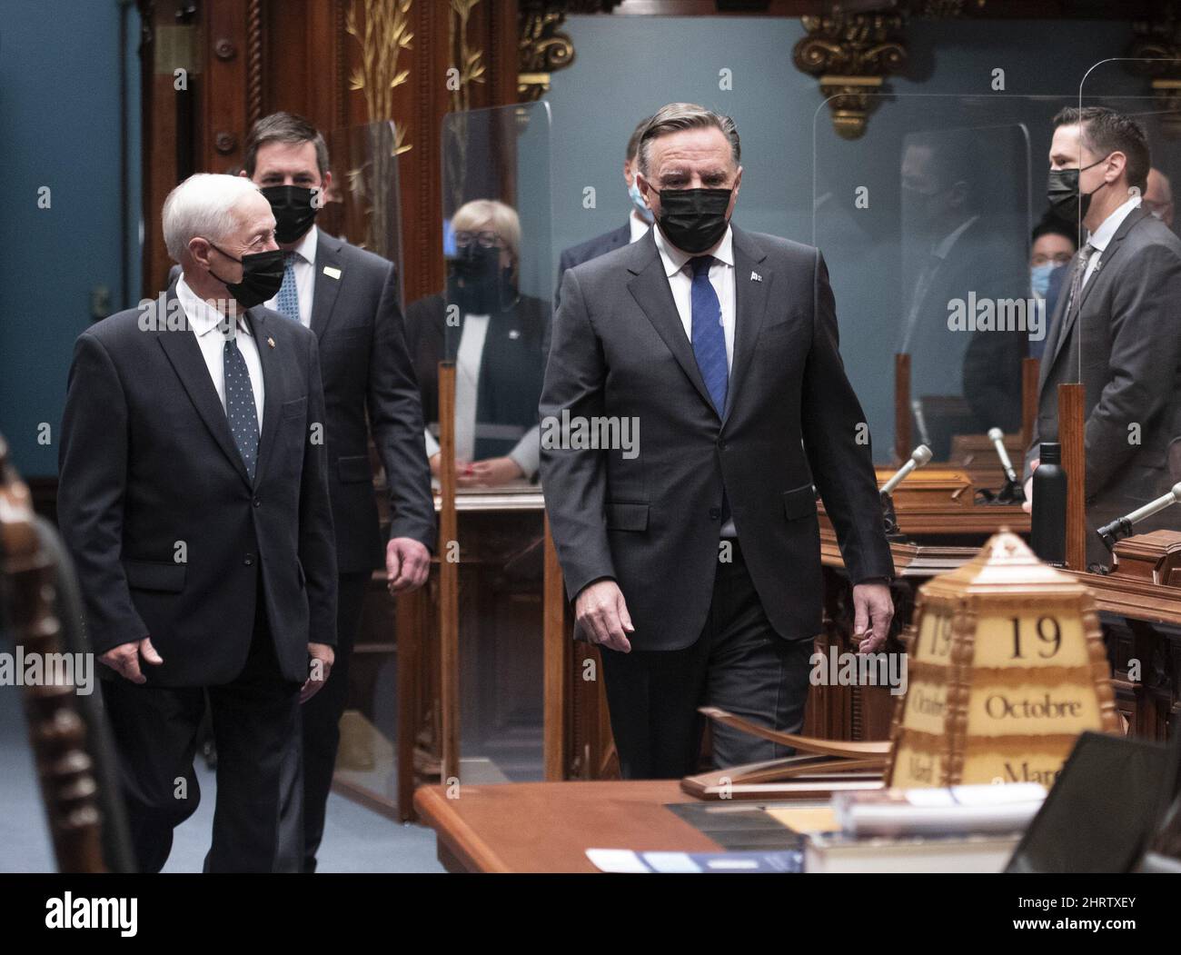 Quebec Premier Francois Legault, right, walks in with Quebec Lt ...