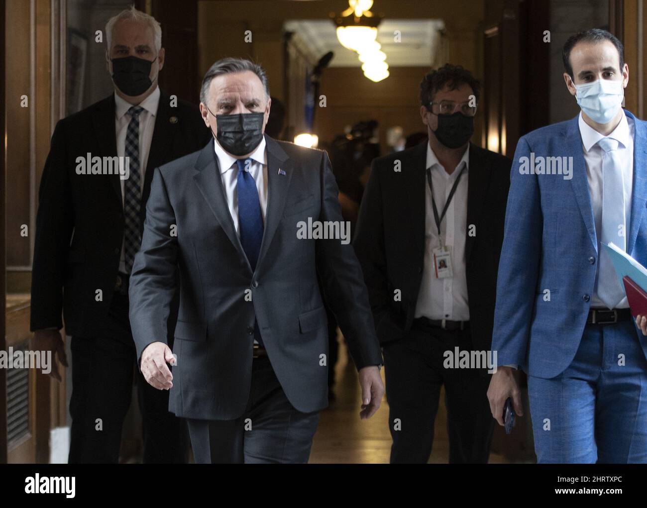 Quebec Premier Francois Legault, left, walks with members of his staff ...