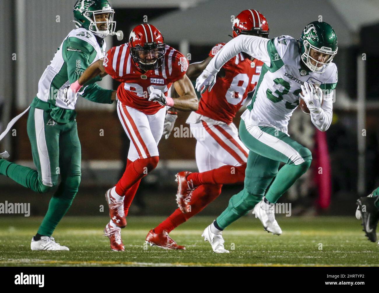 Saskatchewan Roughriders' Jacob Dearborn, right, runs an interception ...