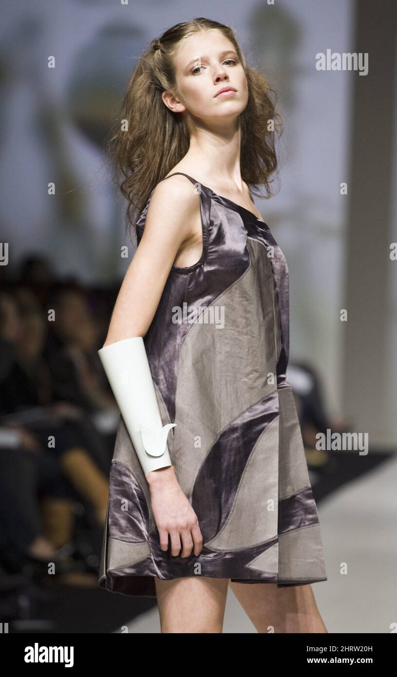 A model wears an outfit on the runway in the "Evan and Dean" show, part ...