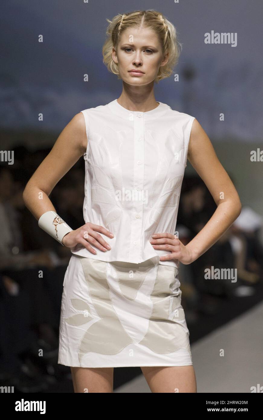A model wears an outfit on the runway in the "Evan and Dean" show, part ...