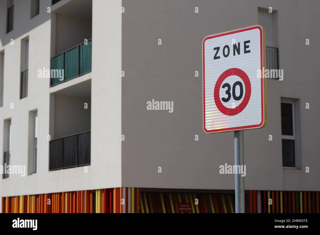 French road traffic sign indicating a zone limited to 30 behind a ...