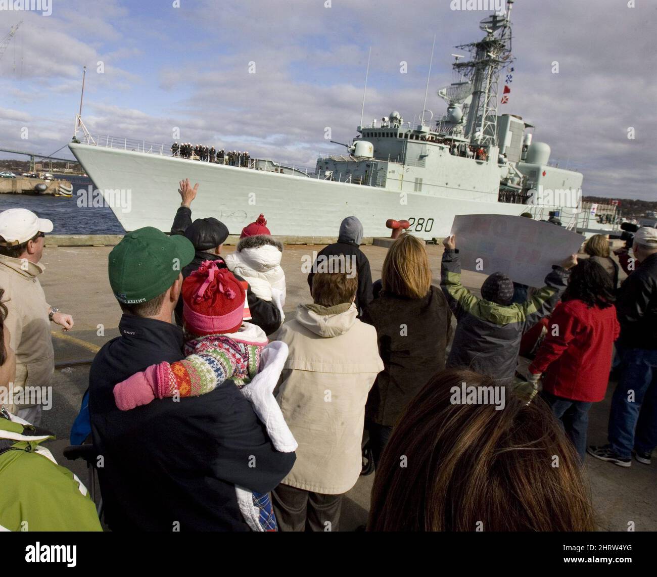 Family and friends wave on the jetty at HMC Dockyard in Halifax on ...