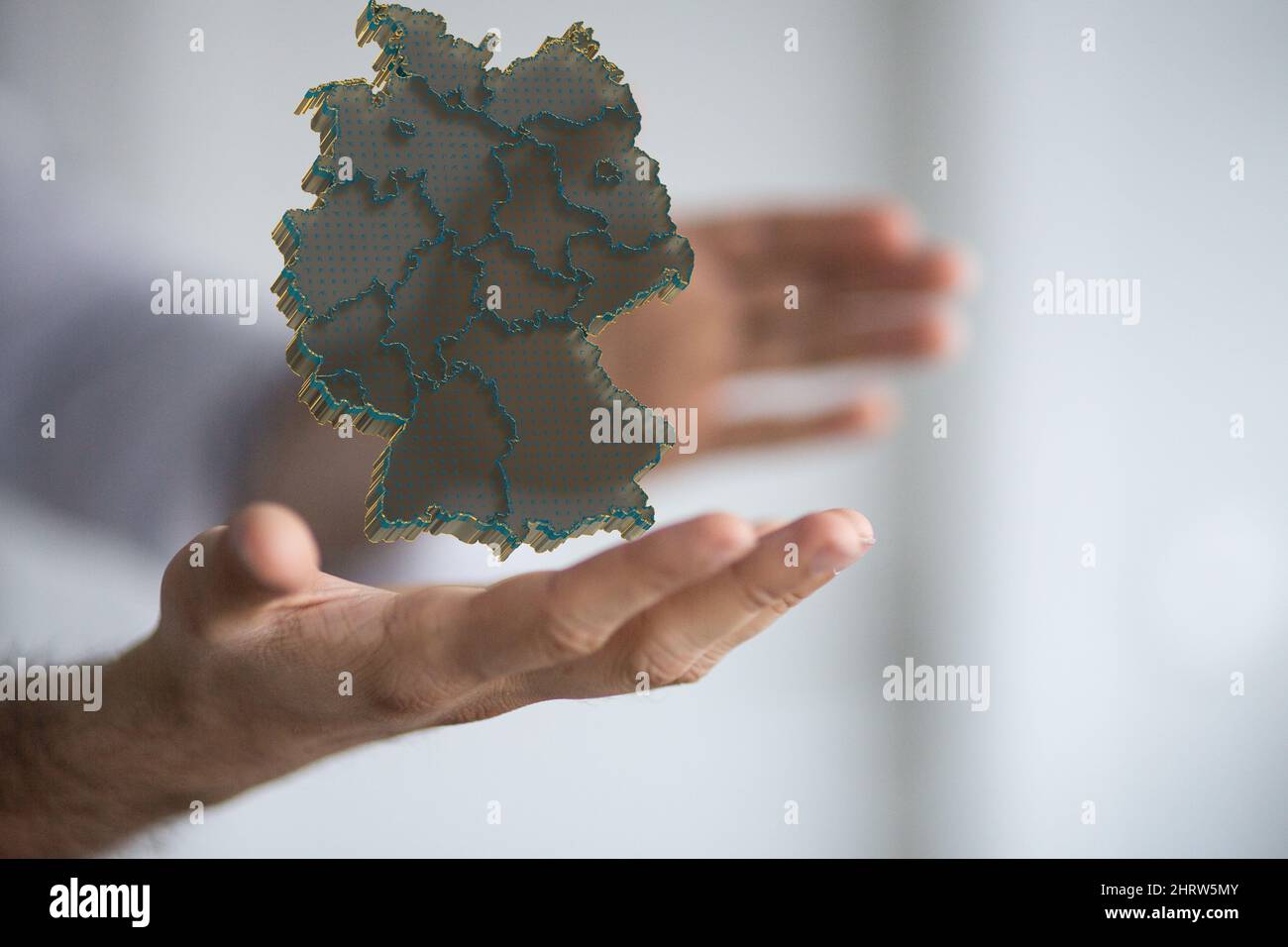 Illustration of of germany map network above the hand Stock Photo - Alamy