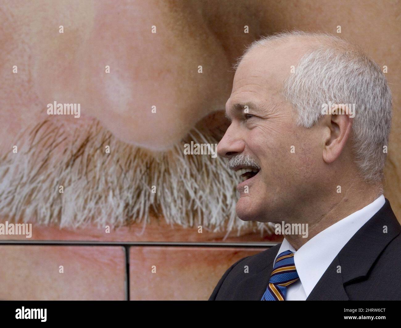NDP Leader Jack Layton stands by his campaign bus picture for an ...